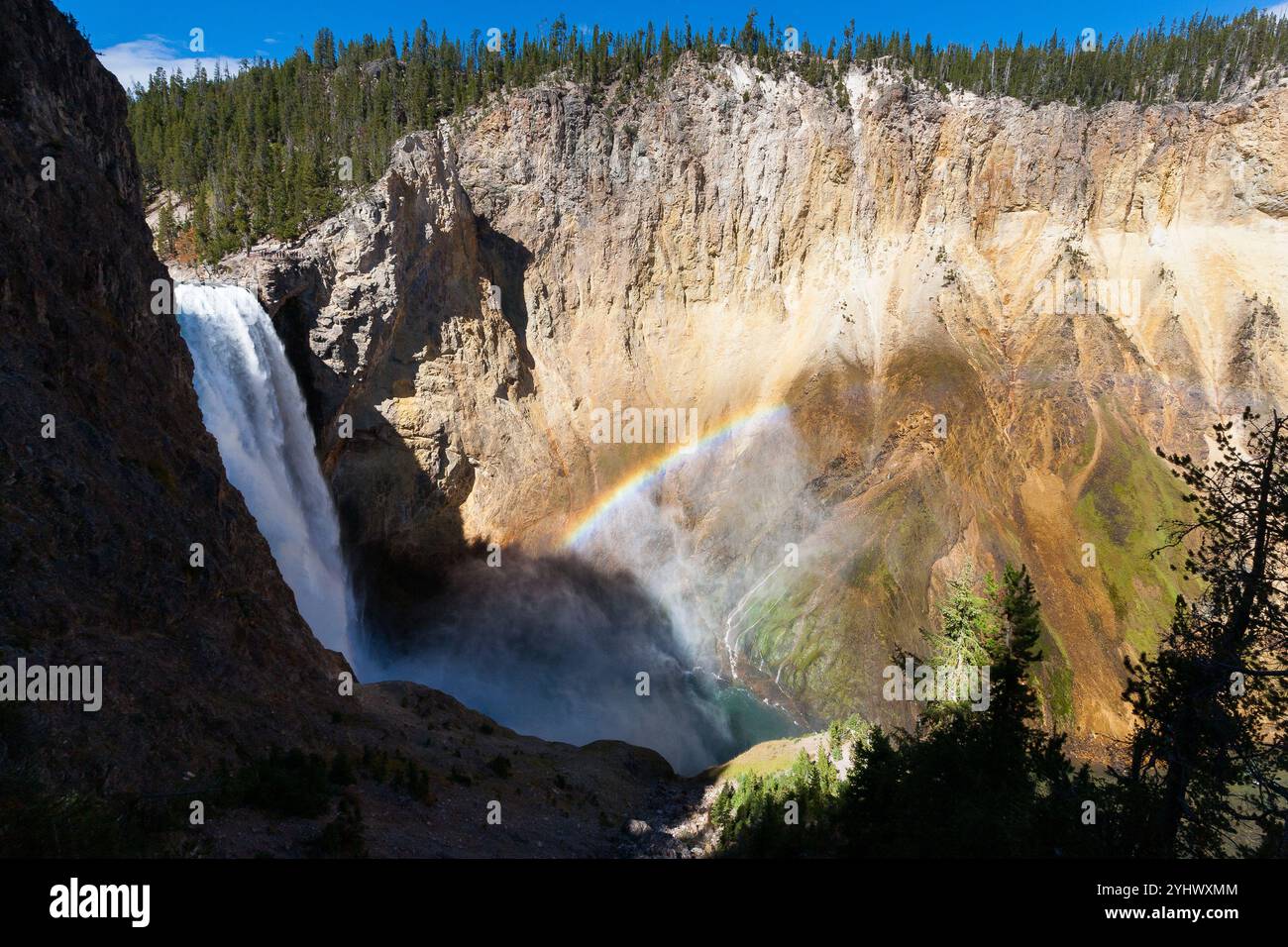 A rainbow forms in the mist of the Lower Falls of the Grand Canyon of ...