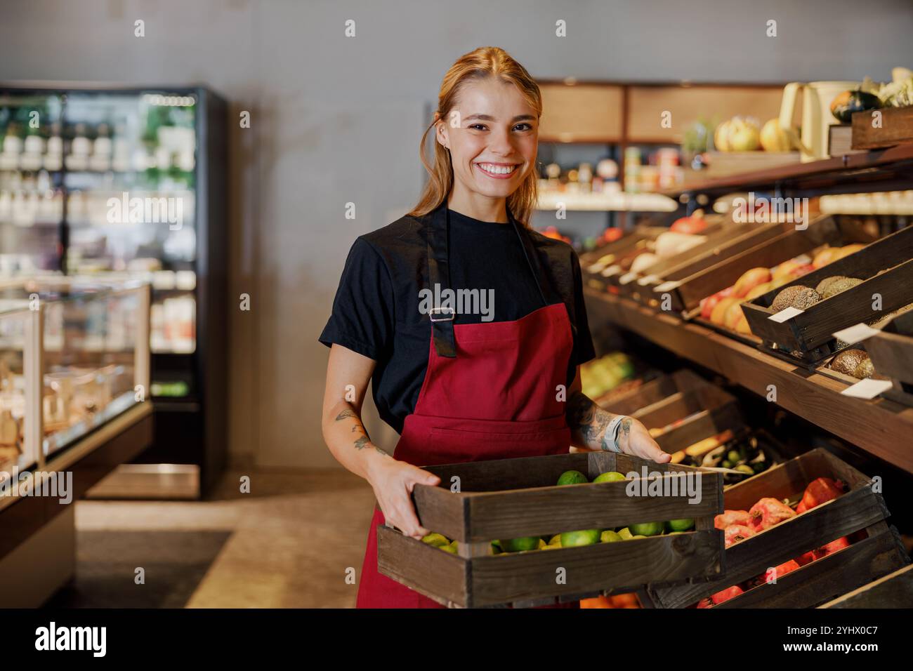 The Bright Smile of a Grocery Store Worker Amidst the Colorful Fresh ...