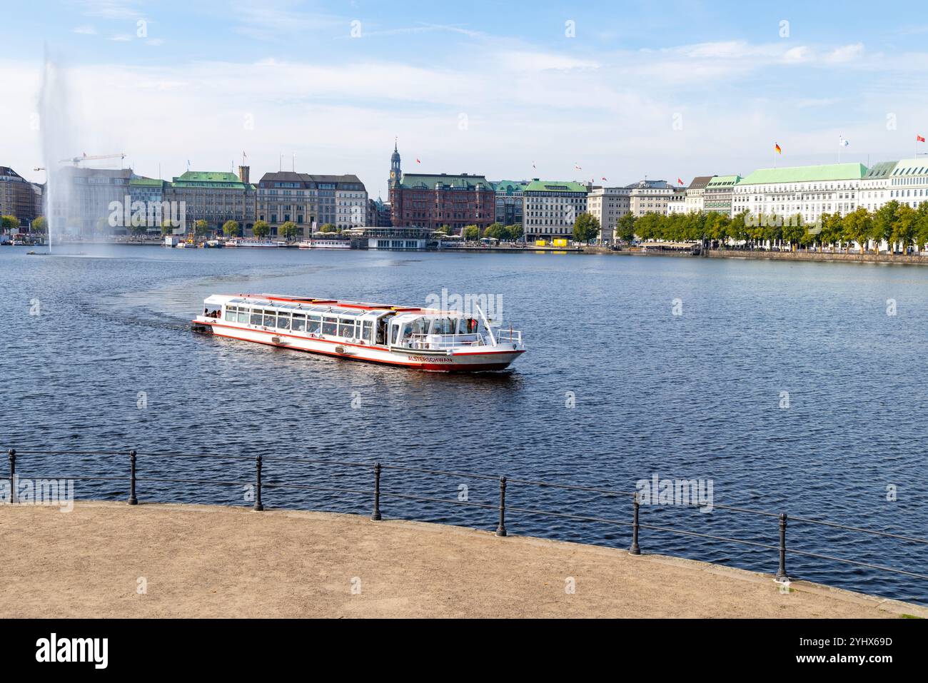 Tour boat packed with visitors travels across Alster Lake with ...