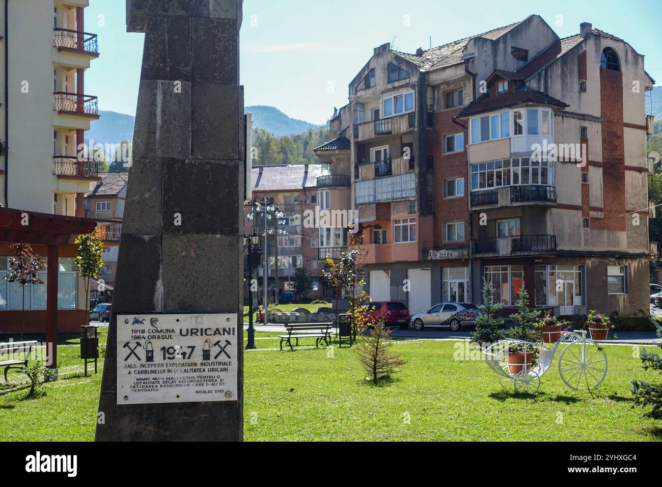 A historical mining history monument in a small European town square ...