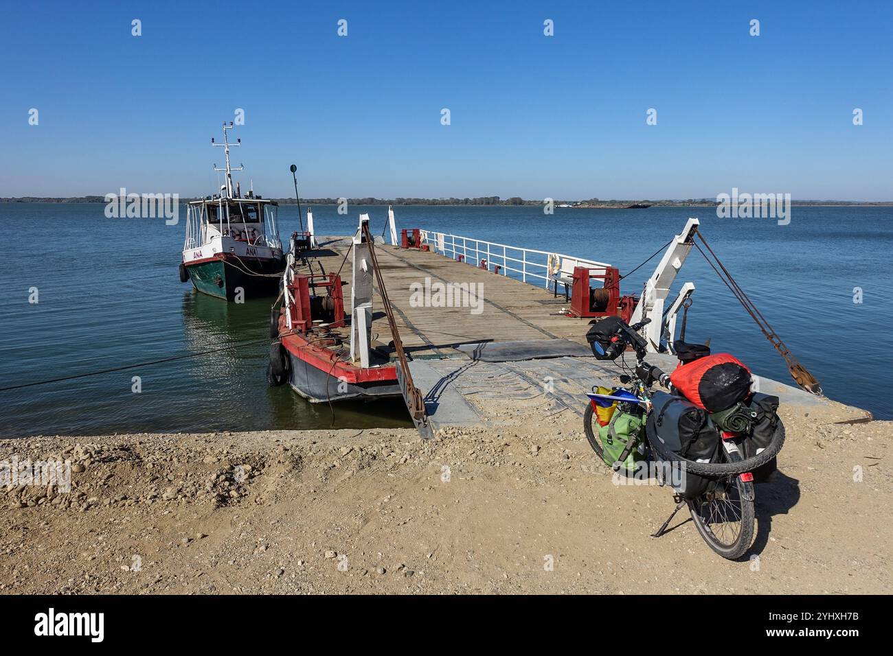 Ram - Stara Palanka ferry (Serbia) boat docked at a calm waterfront on ...
