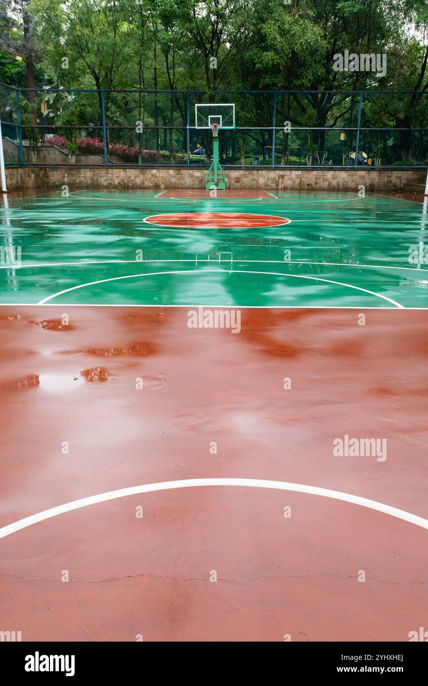 an outdoor basketball court after the rain at vertical composition ...