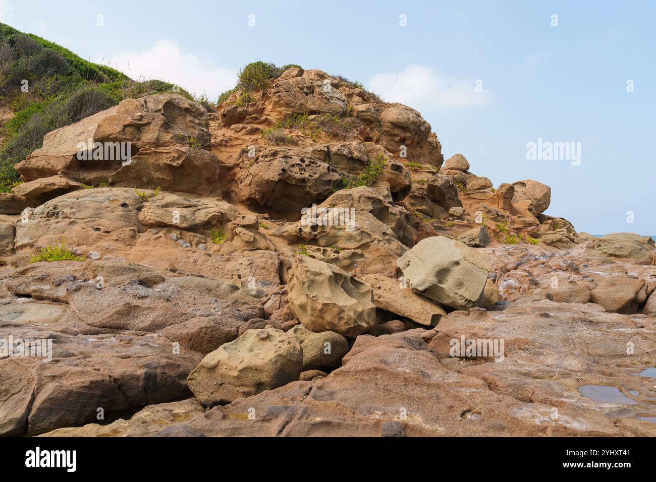 Eroded Rocky Cliffside with Sparse Vegetation Stock Photo - Alamy