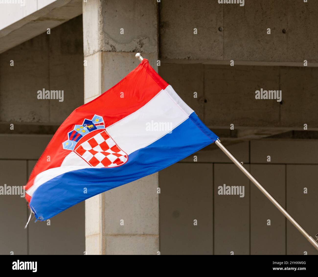 Zadar – HR – Oct 17, 2024 The Croatian flag waves proudly on a pole ...