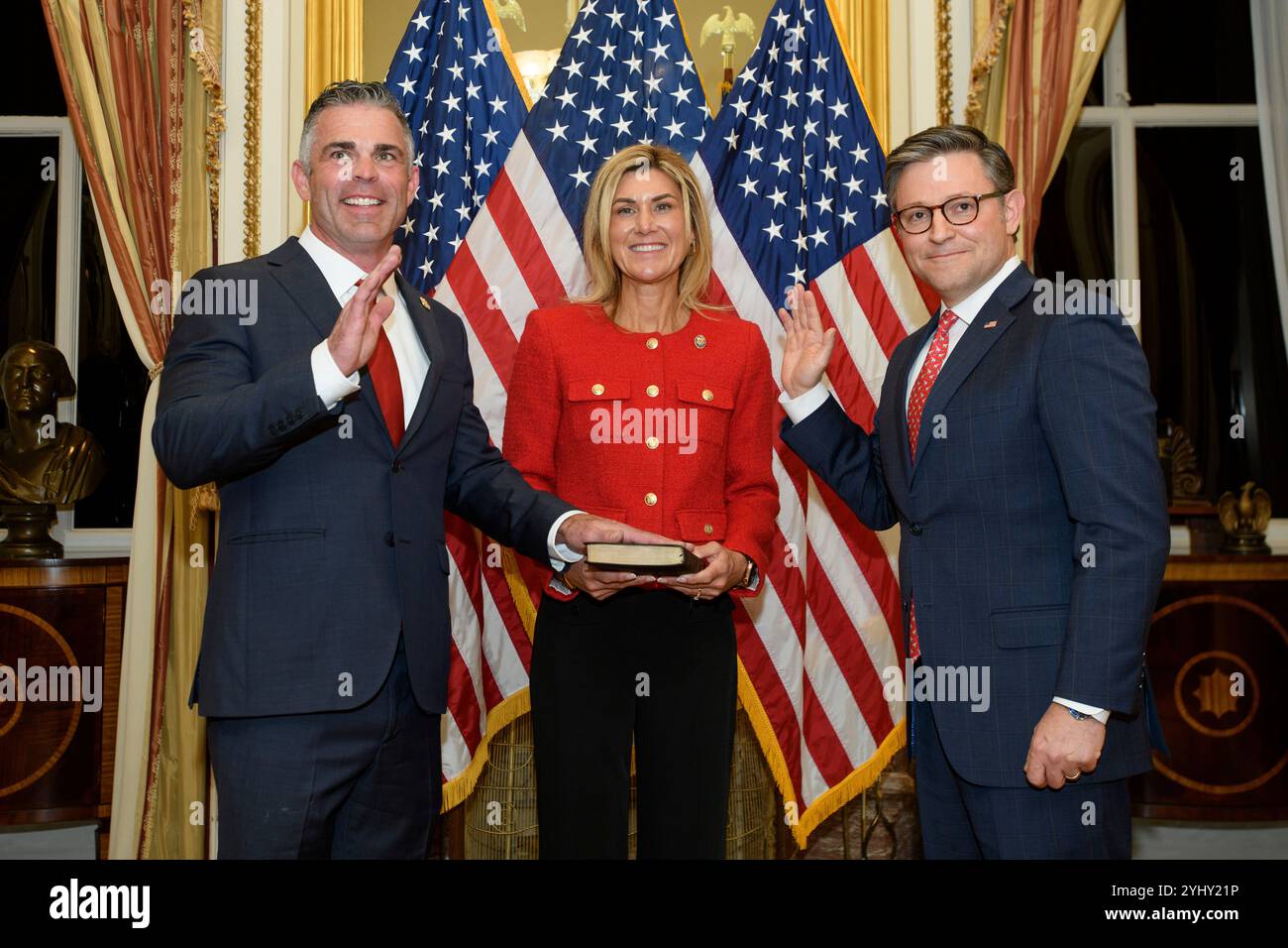 Speaker of the House Mike Johnson, R-La., right, holds a ceremonial ...
