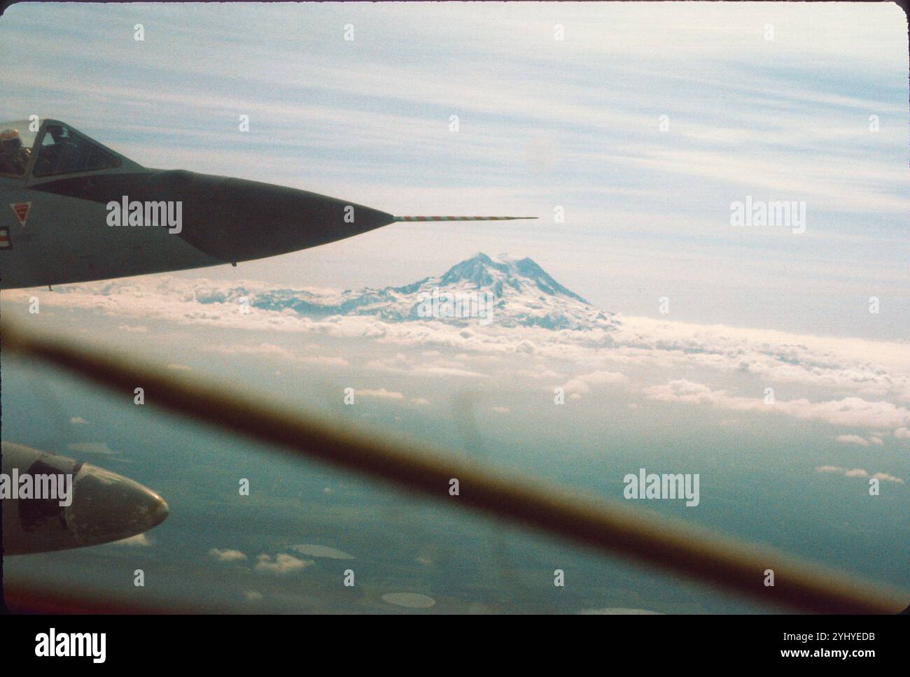 F-106A in fingertip frames Mt Rainier. Top of B model left ext tank ...