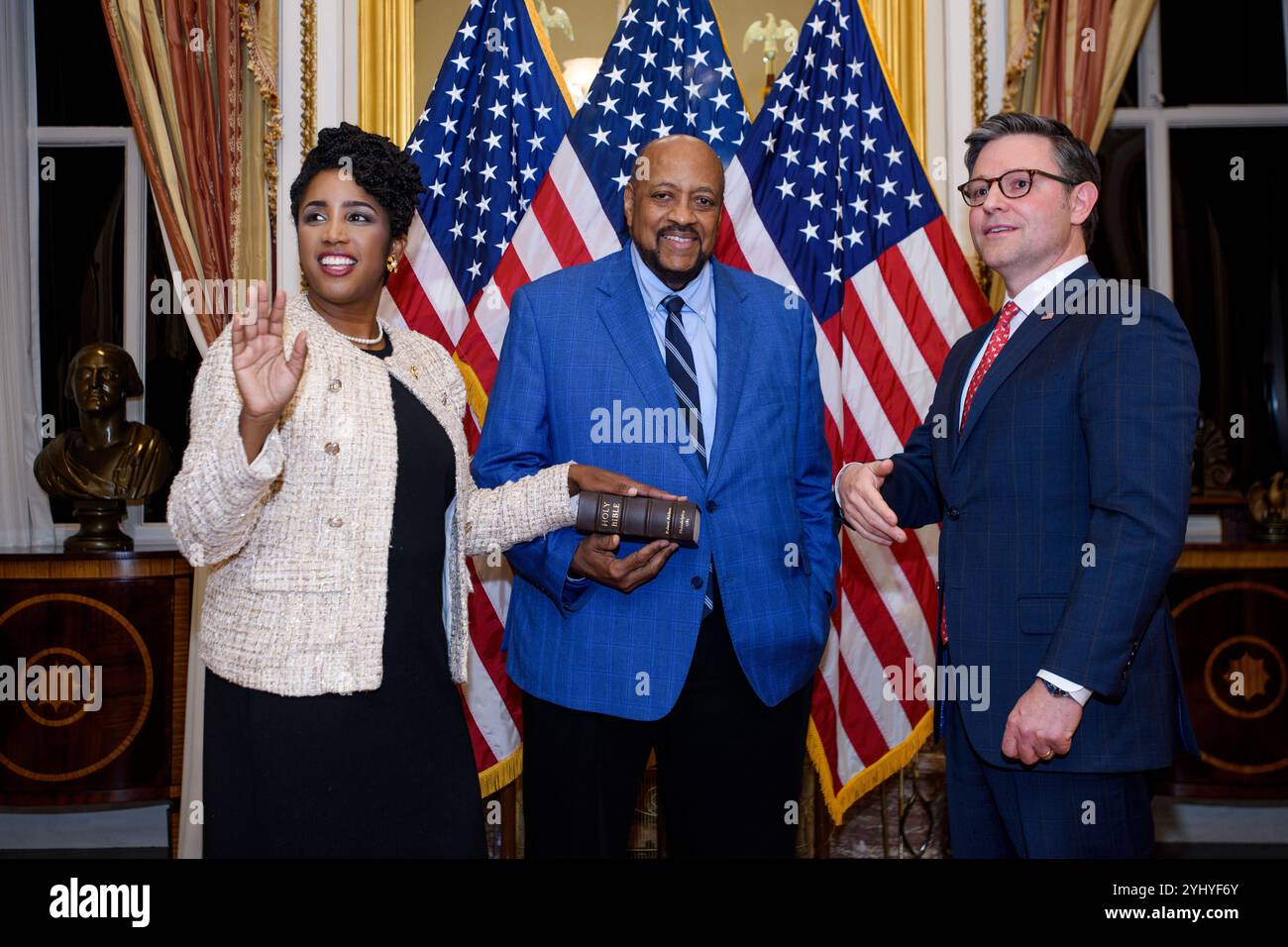 Speaker of the House Mike Johnson, R-La., right, holds a ceremonial ...