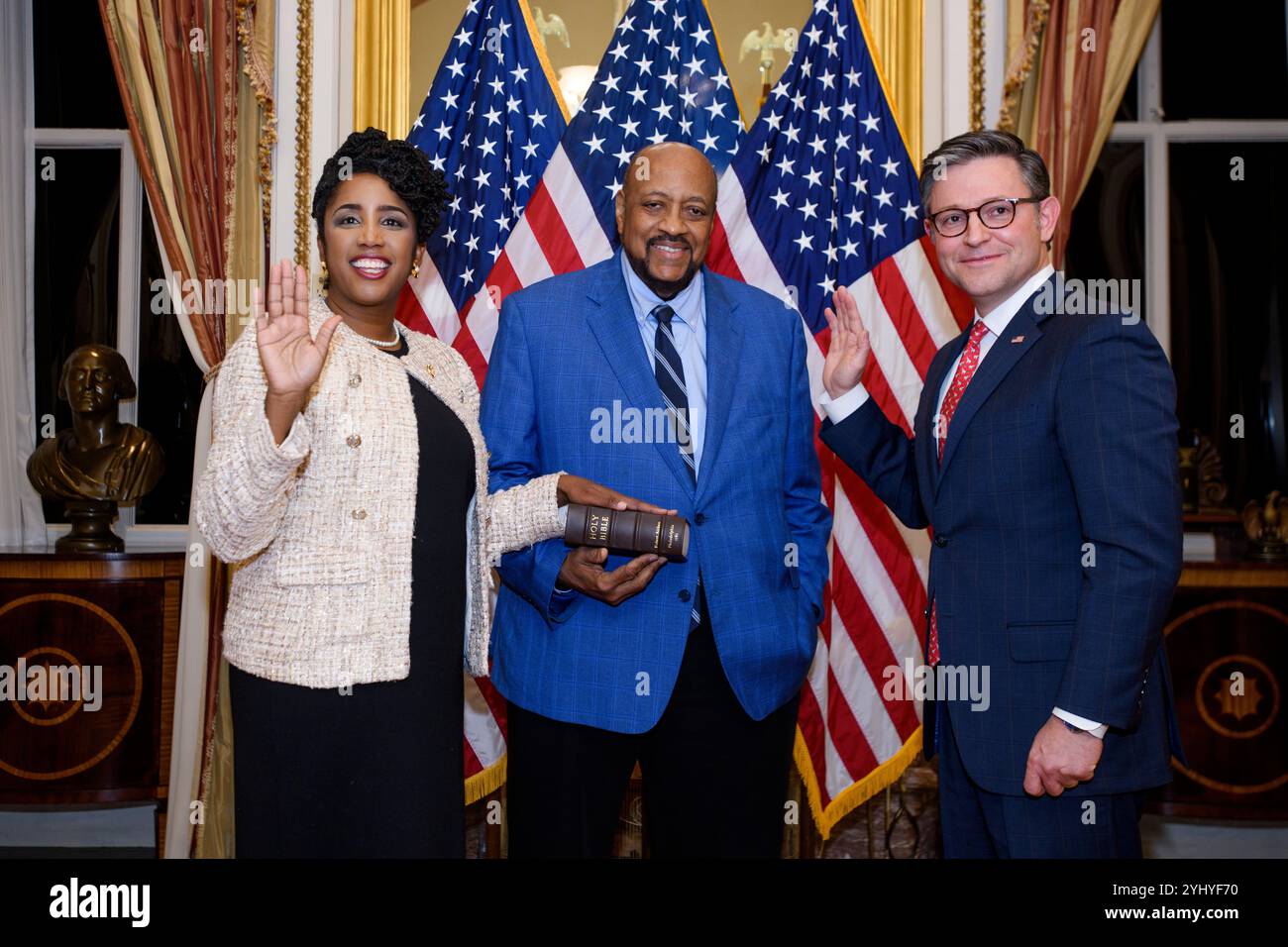Speaker of the House Mike Johnson, R-La., right, holds a ceremonial ...