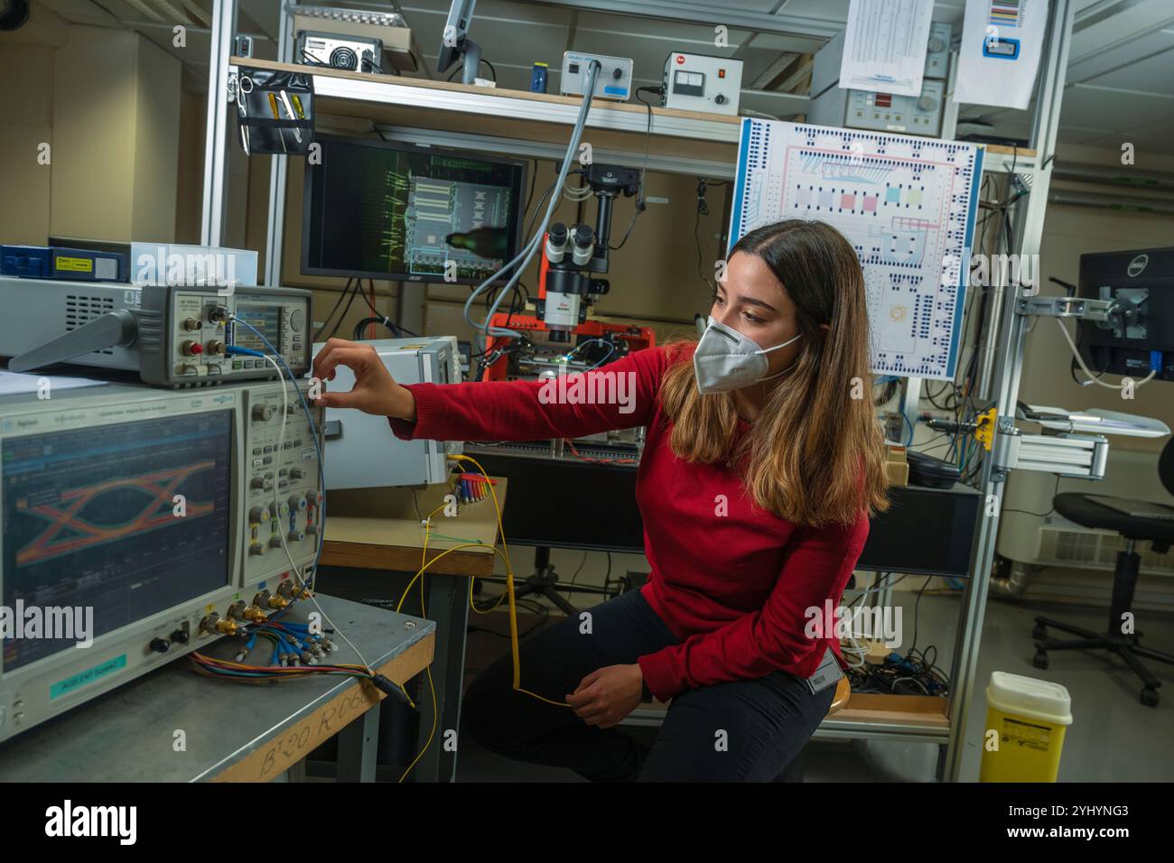 Engineer Thenia Prousalidi working on the development of a radiation-hard optical transceiver ...