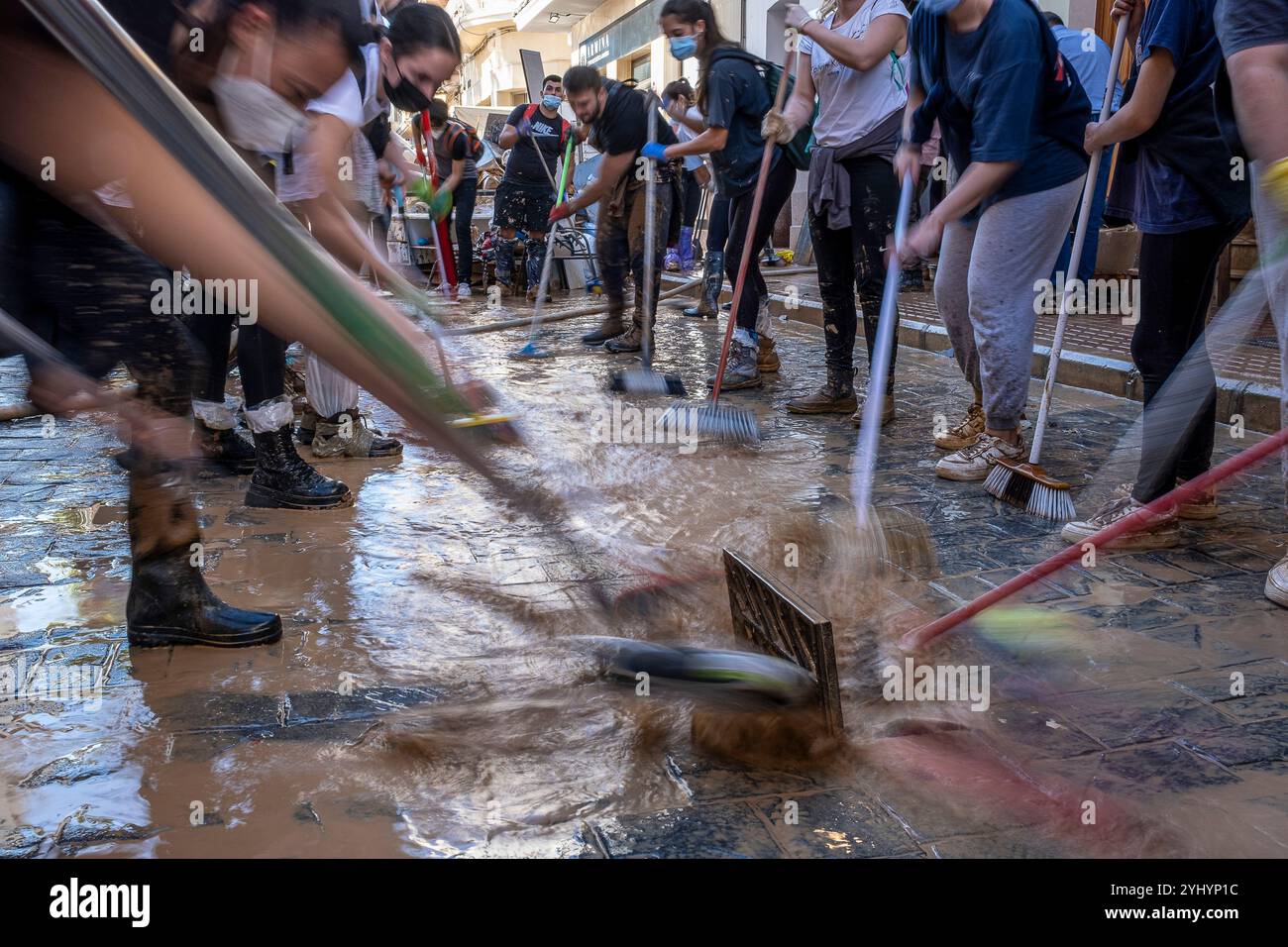 Volunteers cleaning a street in Paiporta, Valencia, Spain, in the ...