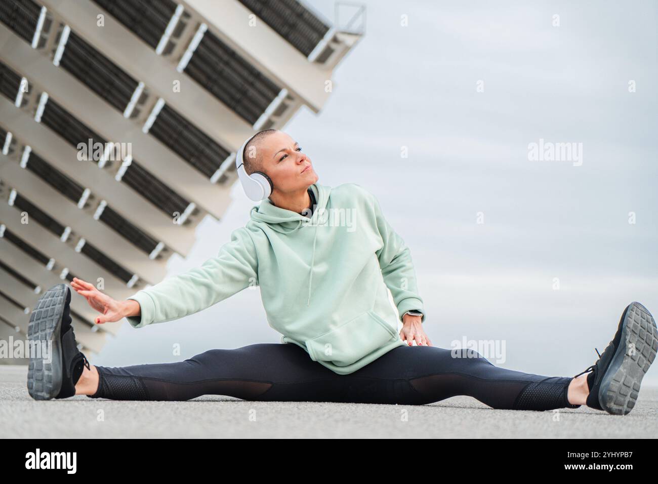 Determined focused athlete performing stretching hi-res stock ...