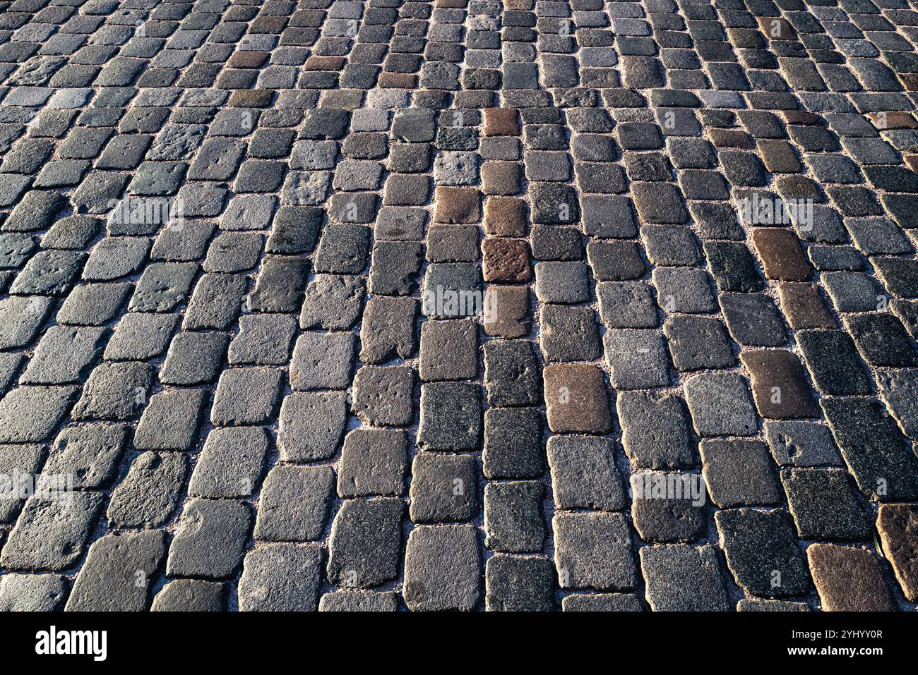 Pavement road. Background of bricks road. Stone cladding pavement ...