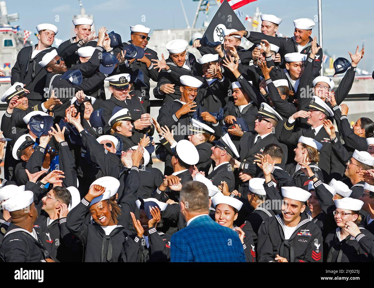 San Diego, Ca, USA. 10th Nov, 2024. Sailors reach for free hats thrown ...