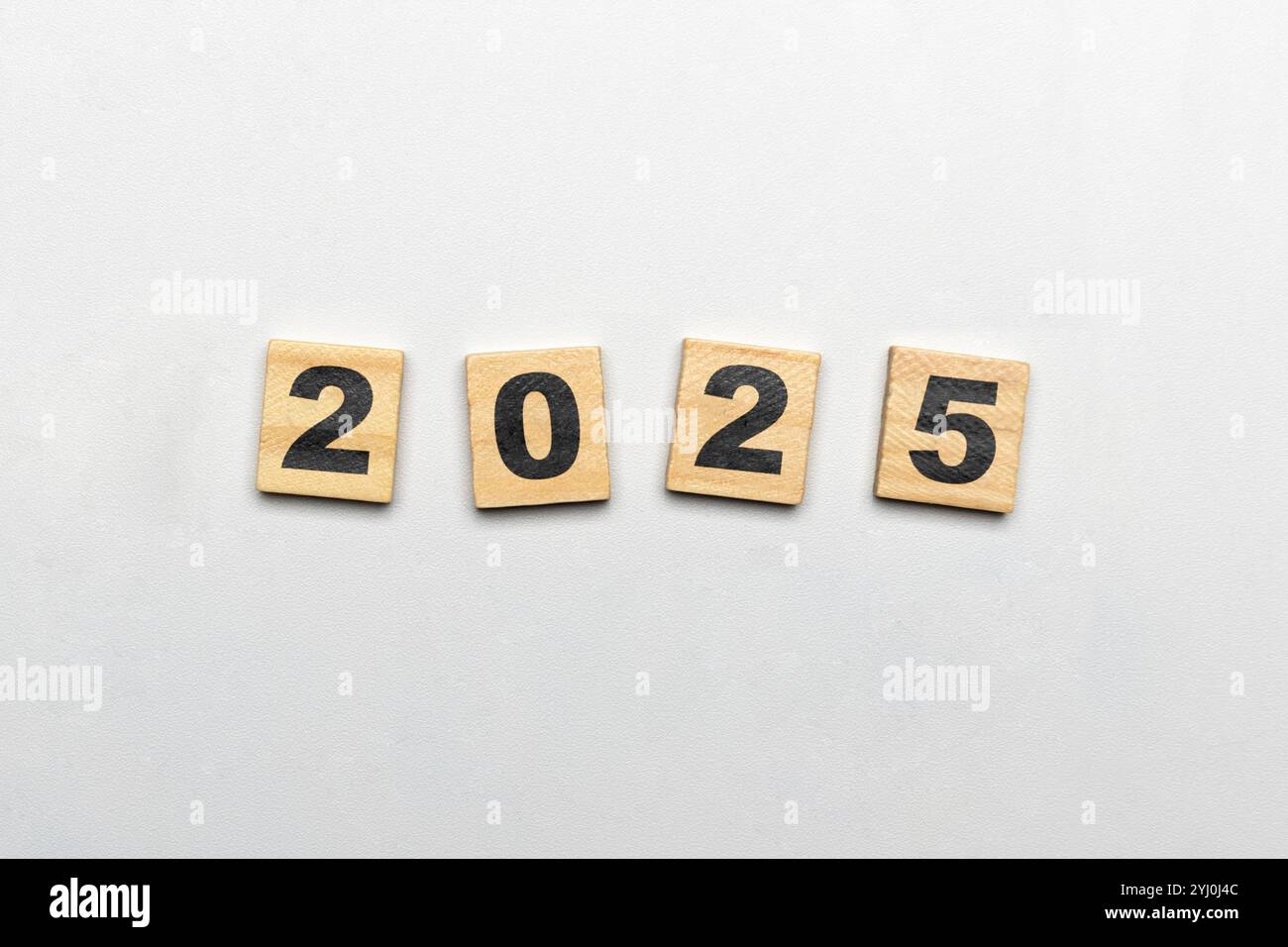 Wooden blocks with number 2025 on white background. Happy New Year ...