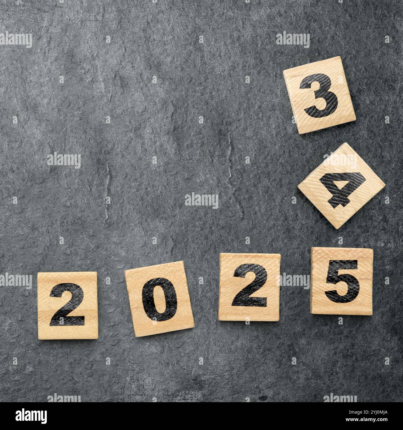 Wooden blocks with number 2025 on black background. Happy New Year ...
