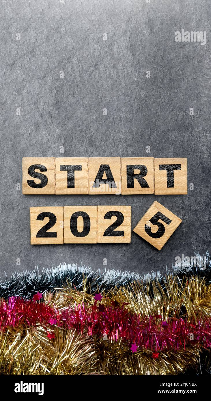 Wooden blocks with text of start 2025 on black background. Happy New ...