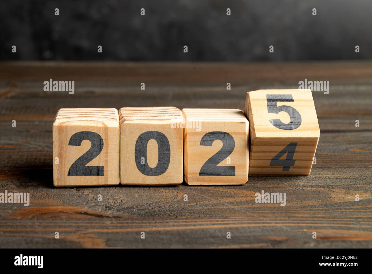 Wooden blocks transform from number 2024 to 2025 on the table. Happy ...