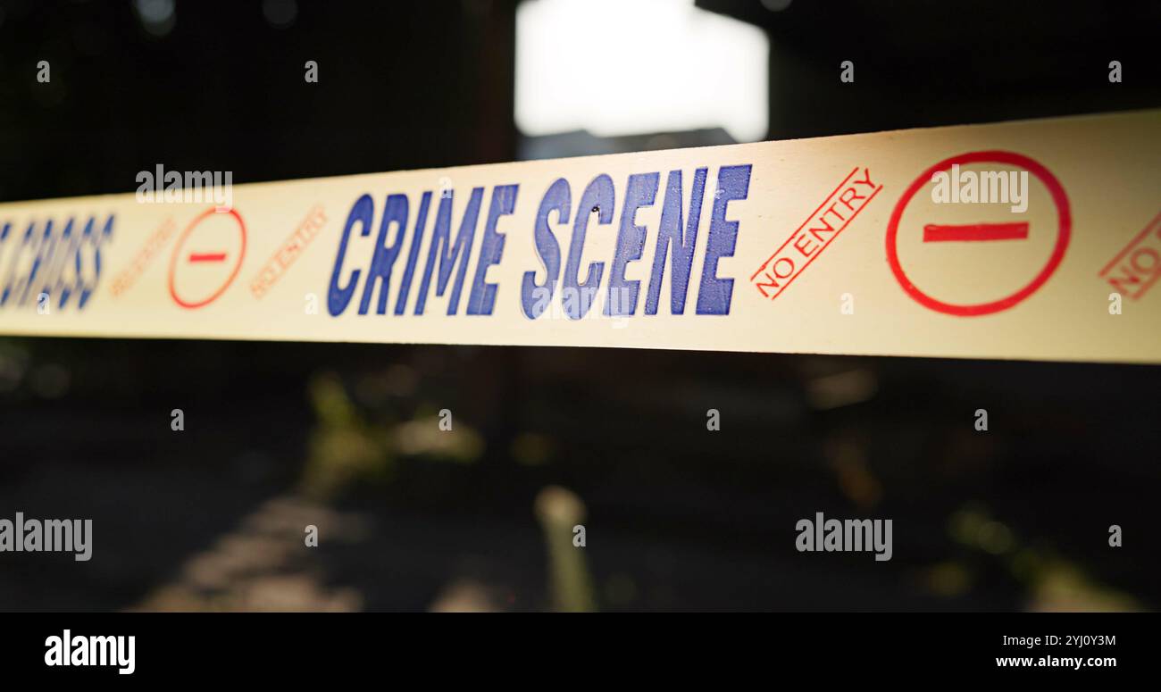 Outdoor, crime scene and yellow tape for investigation, forensics and ...