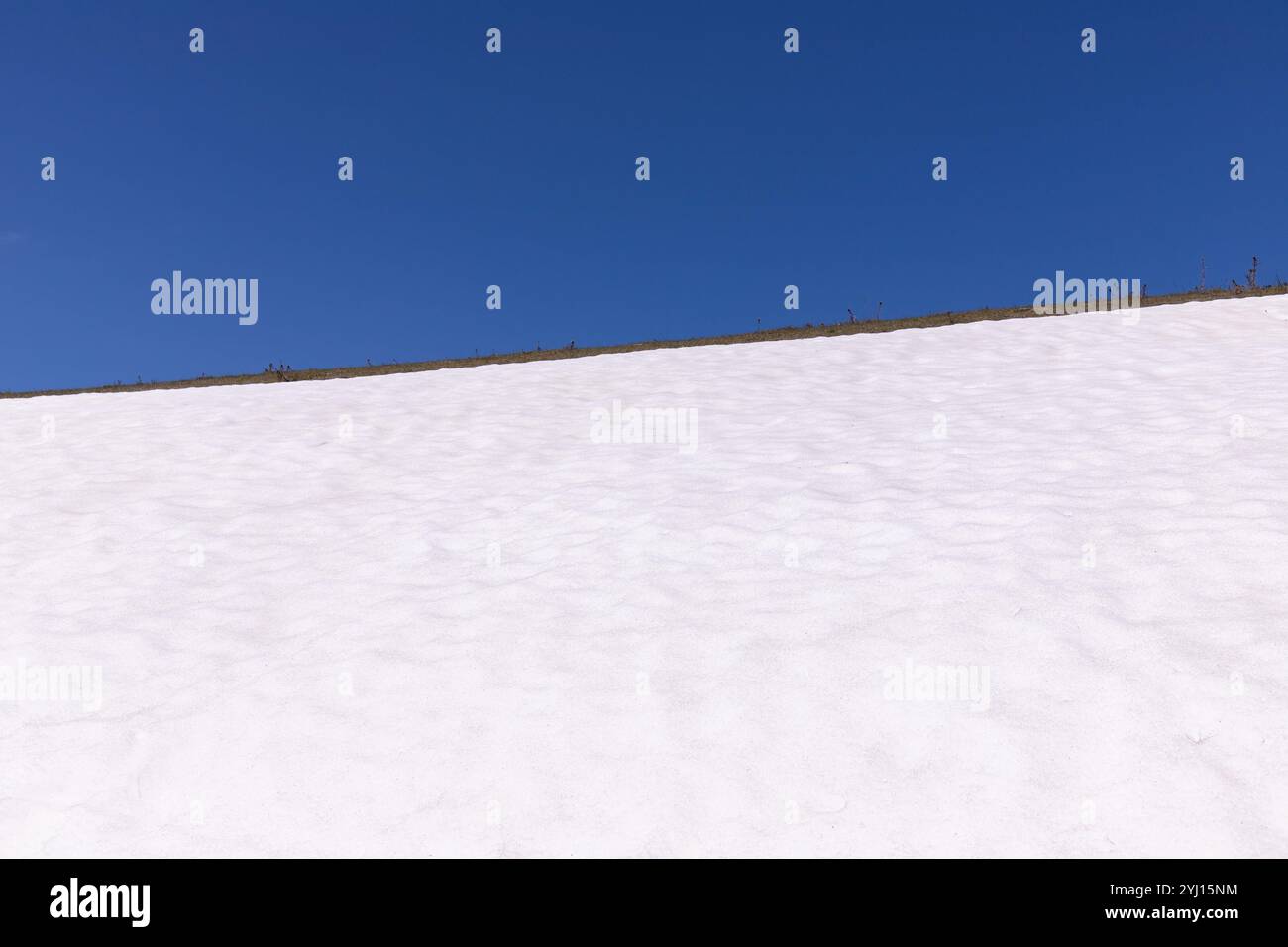 The slope has smooth snow and blue skies Stock Photo - Alamy