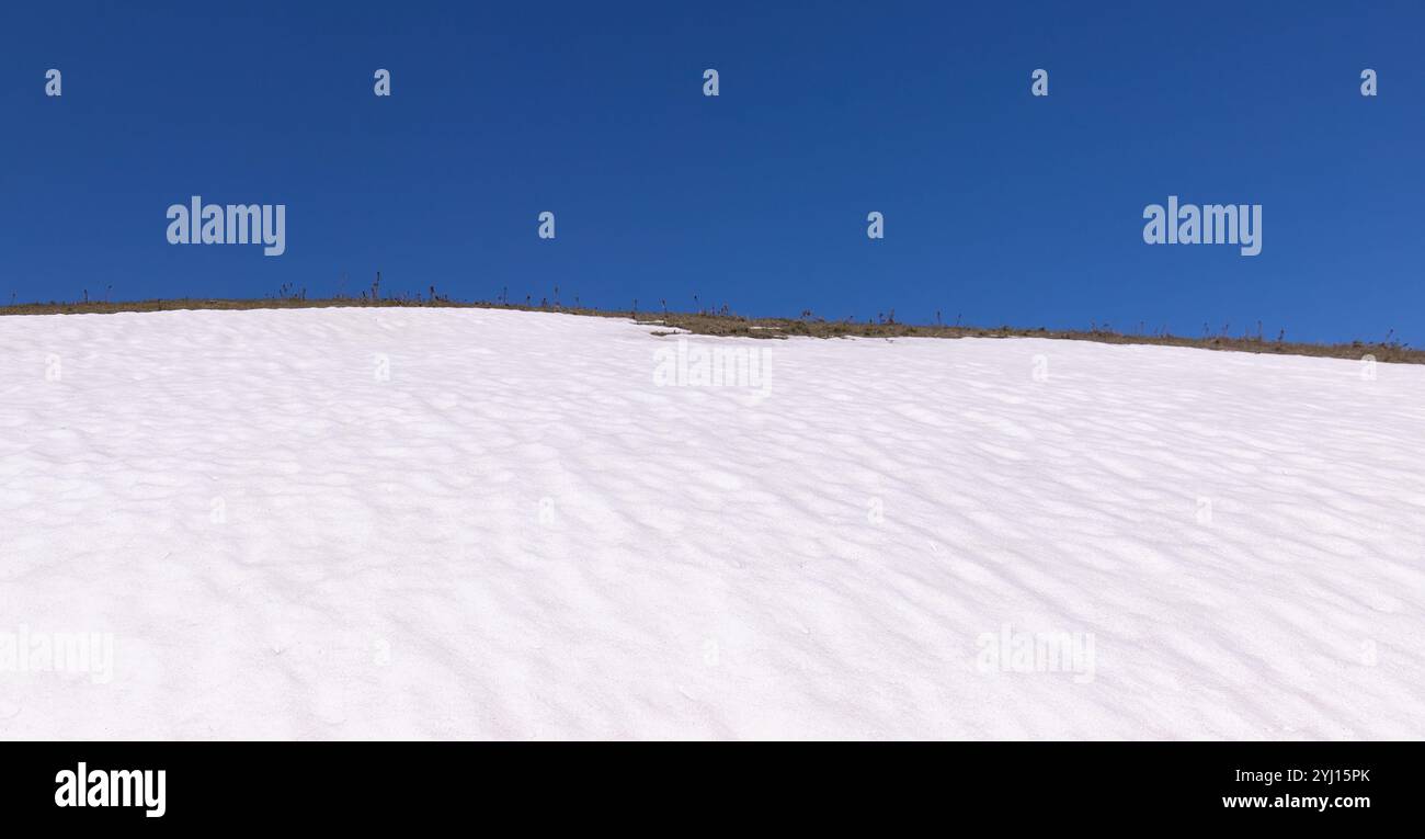 The slope has smooth snow and blue skies Stock Photo - Alamy