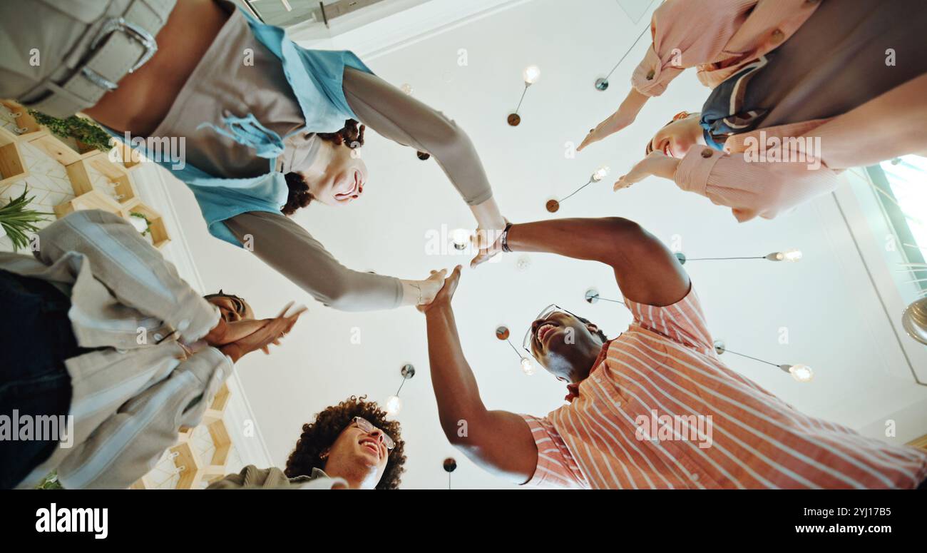 High five, low angle and teamwork with business people in office for contract success, agreement ...