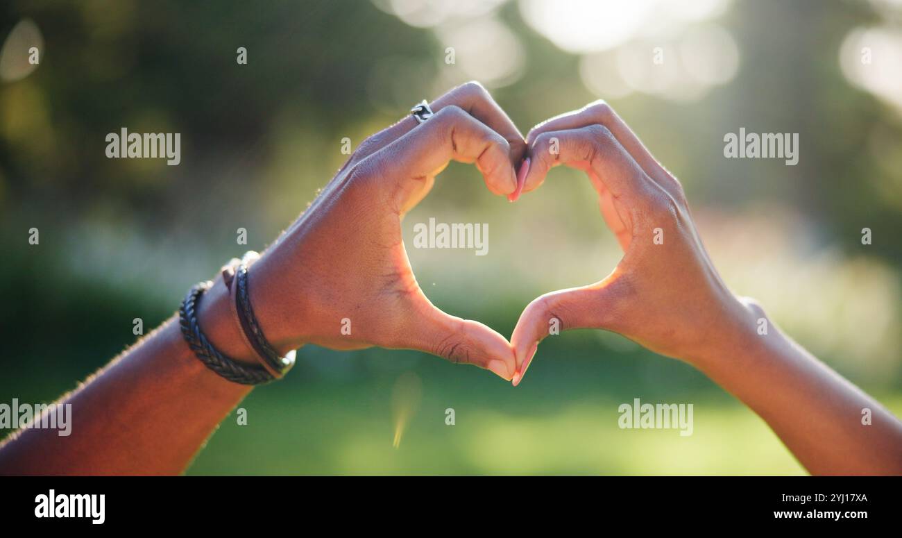 Love, heart and hands of couple in nature with gesture for support ...