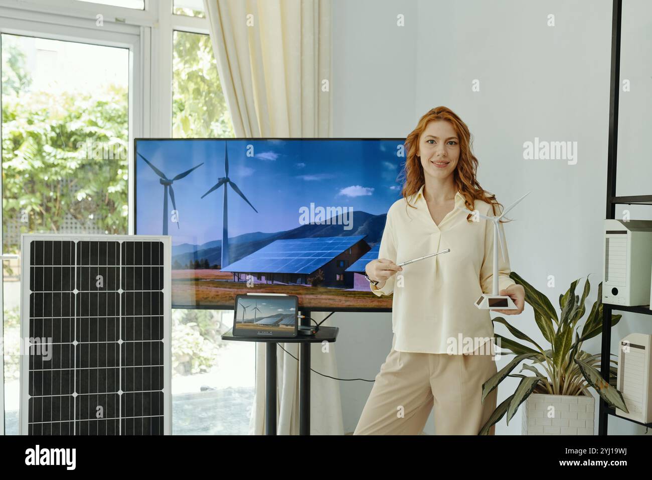 Young Engineer Presenting Green Energy In Office Stock Photo - Alamy