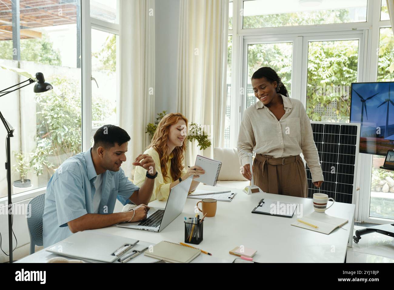 Group Of Engineers Working In Team In Office Stock Photo - Alamy