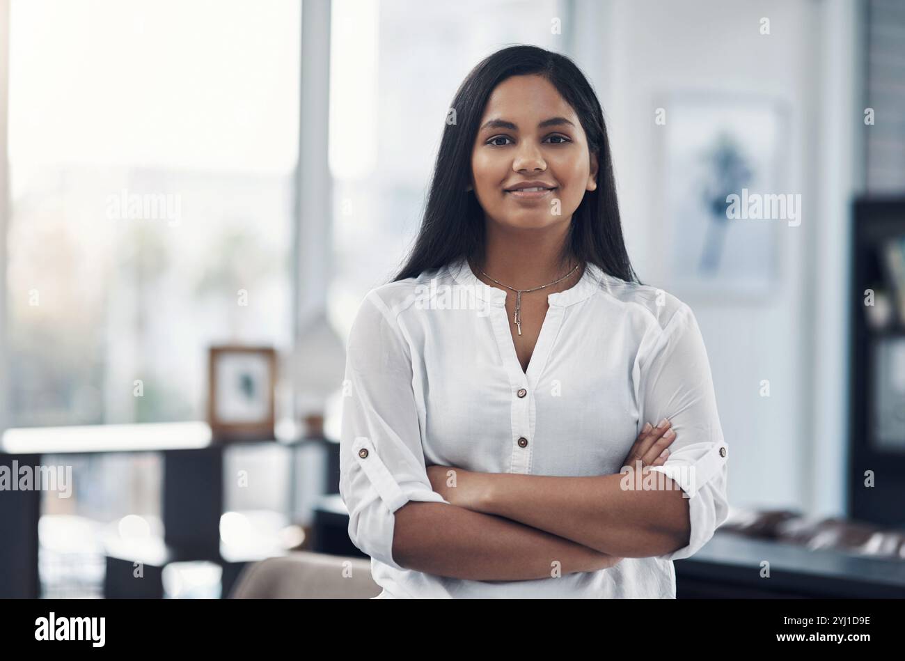 Portrait, business and creative woman with arms folded in office for ...