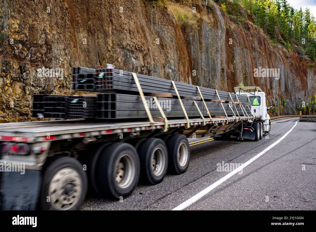 Powerful white day cab big rig semi truck with roof spoiler ...