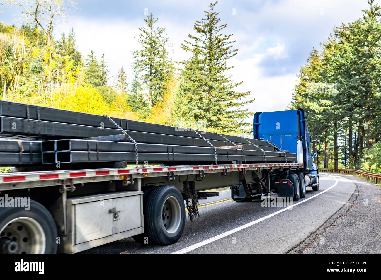 Powerful blue big rig semi truck with extended cab for truck driver ...