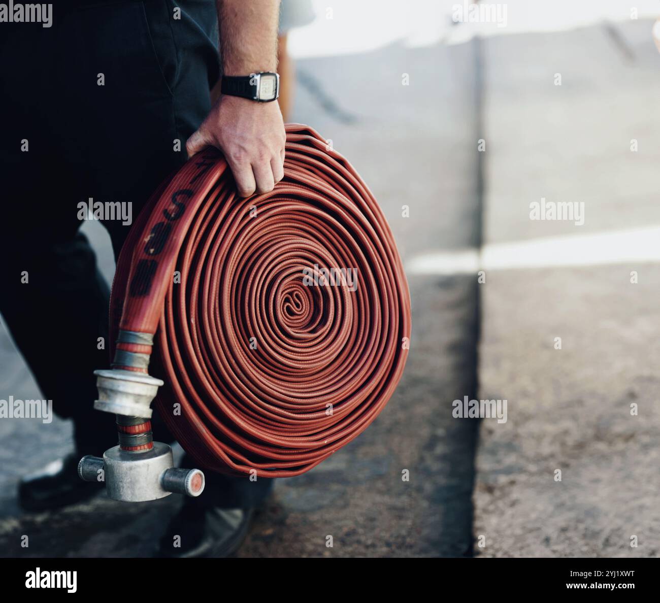 Fire hose in hand hi-res stock photography and images - Alamy