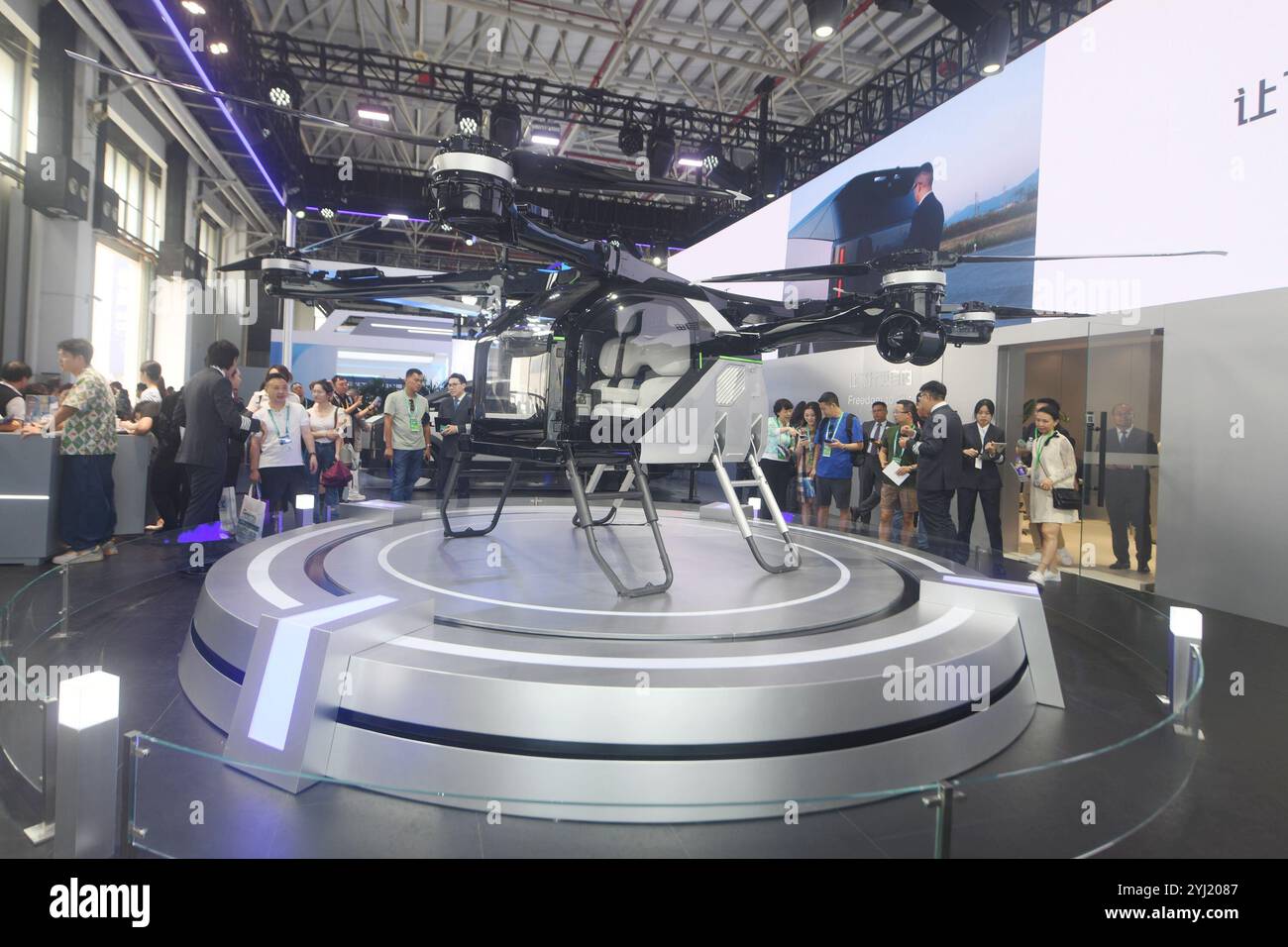 ZHUHAI, CHINA - NOVEMBER 13, 2024 - Visitors view the electric vertical ...