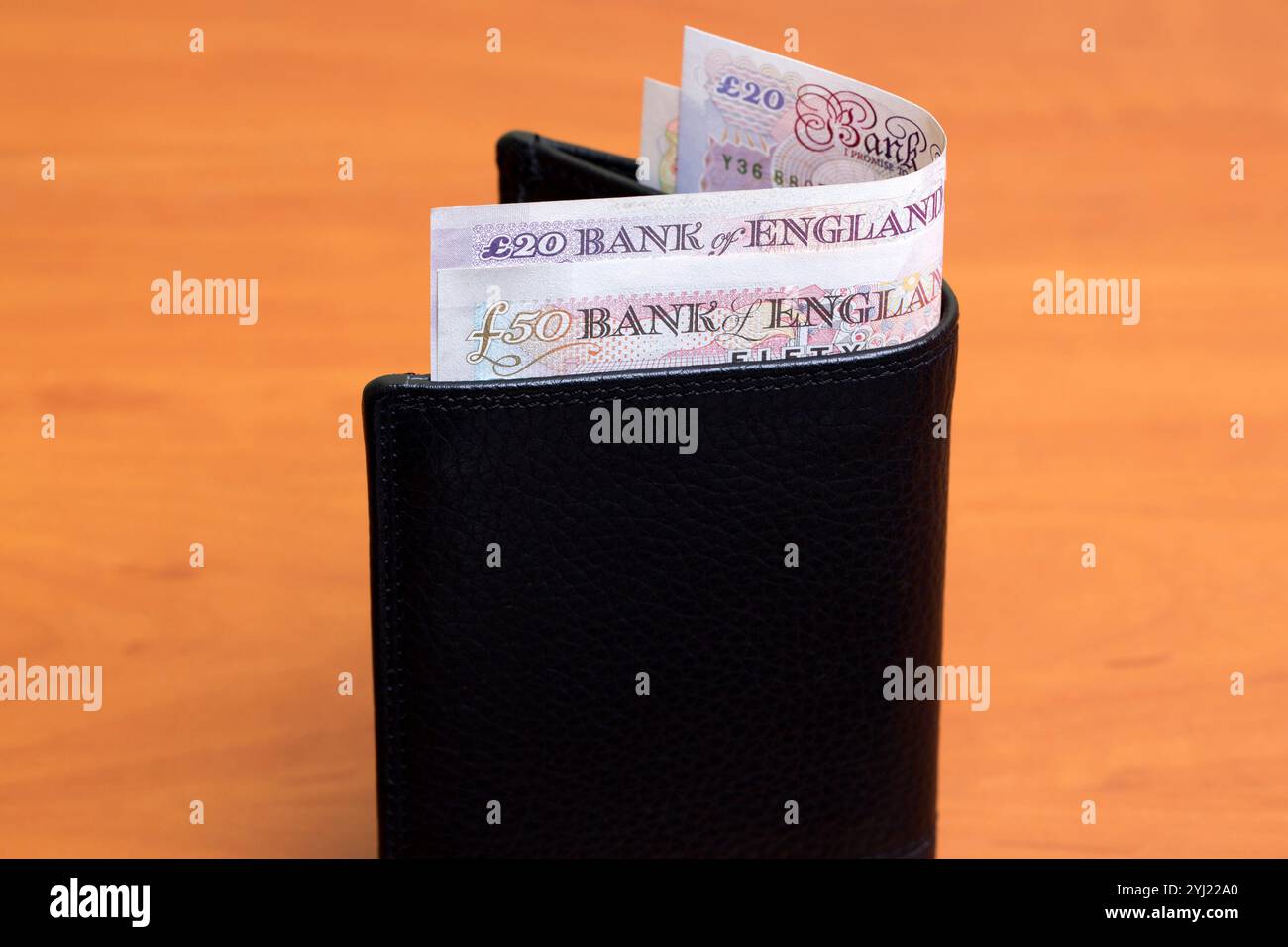 Old British money - pound in the black wallet Stock Photo - Alamy