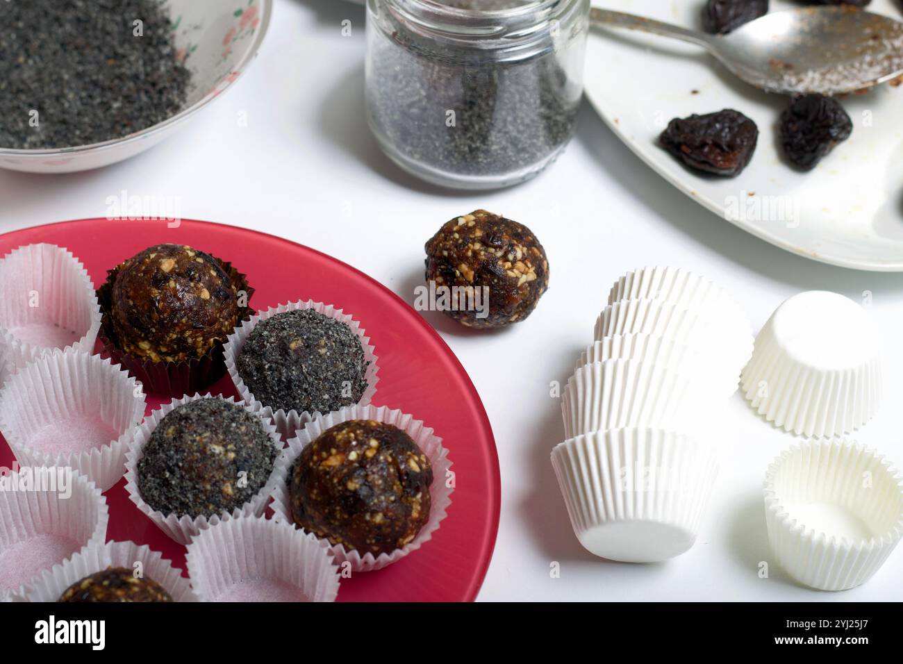 Dried fruit sweets. Balls of prunes, dates and coconut. With a sprinkle ...
