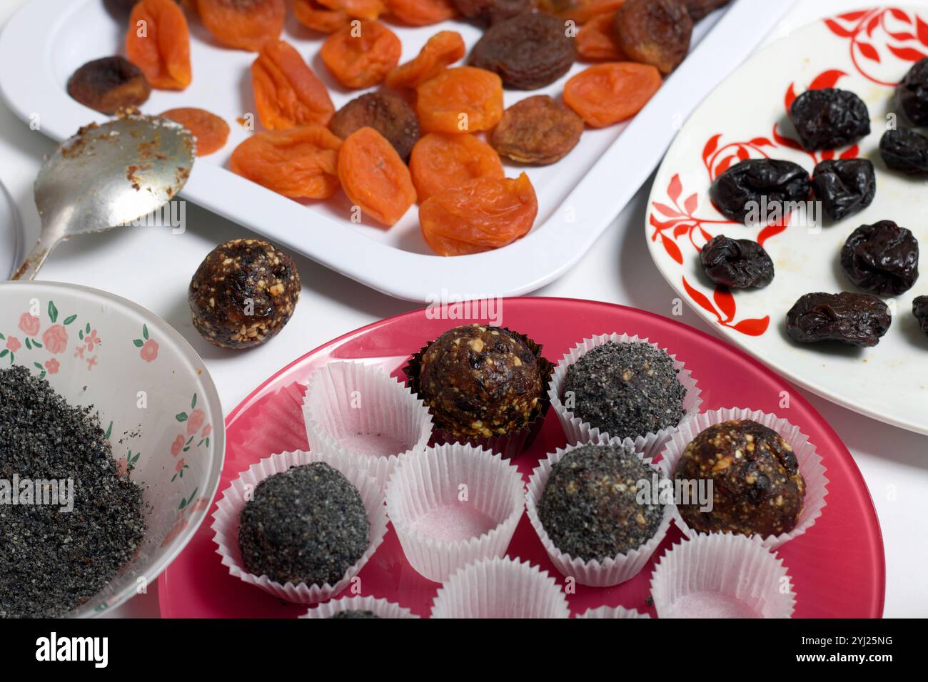 Dried fruit sweets. Balls of prunes, dates and coconut. With a sprinkle ...