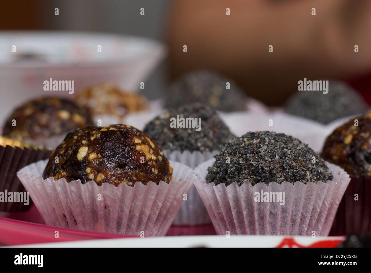 Dried fruit sweets. Balls of prunes, dates and coconut. With a sprinkle ...