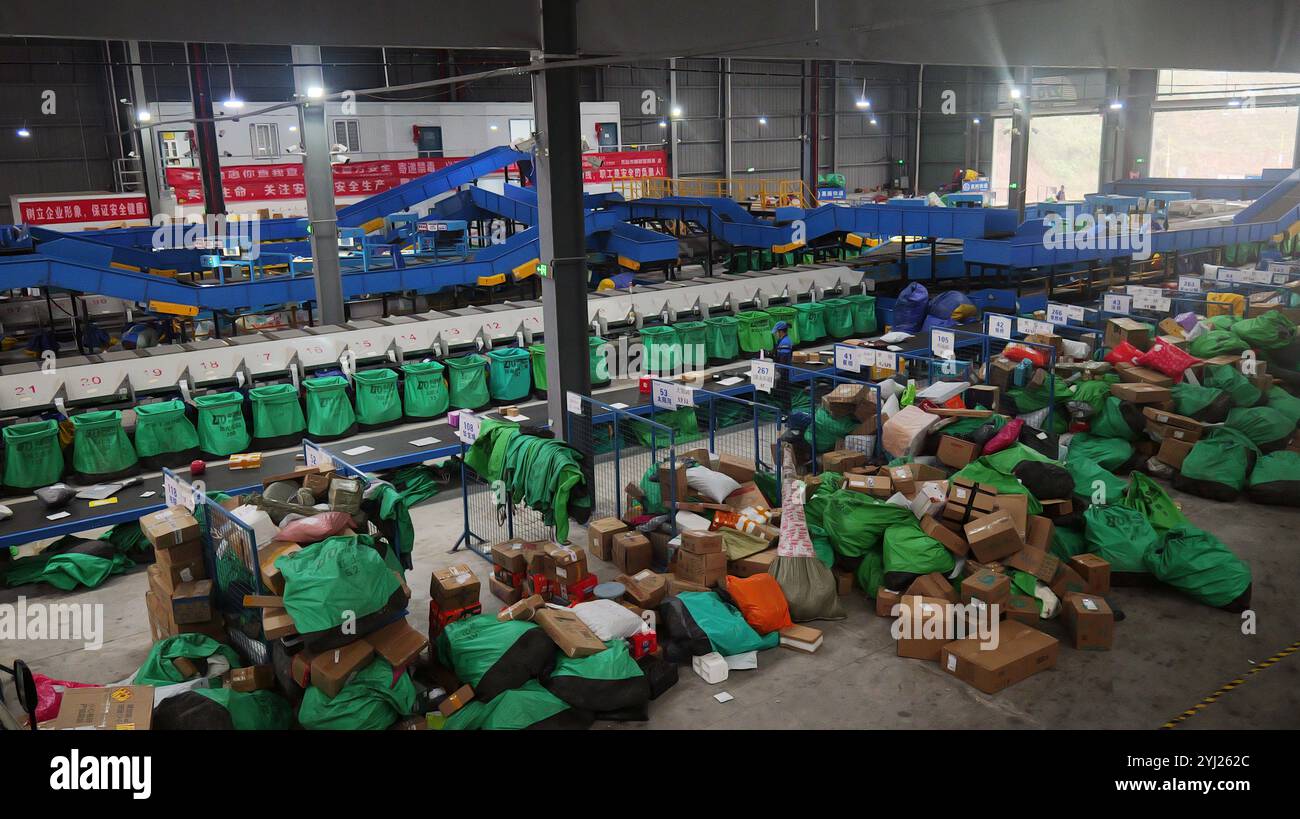 Workers of a Courier company carry out sorting on a smart express line ...