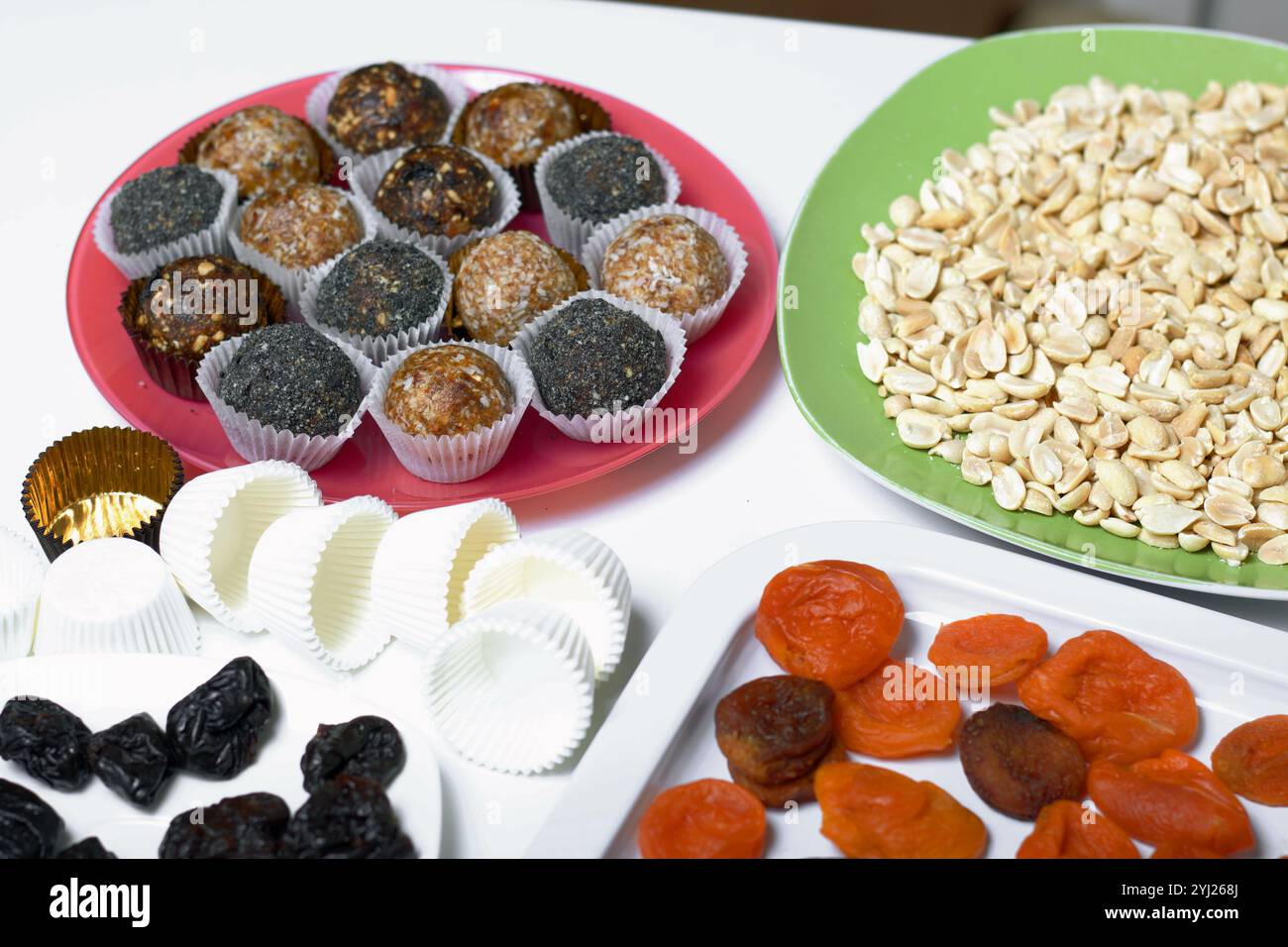 Dried fruit sweets. Balls of prunes, dates and coconut. With a sprinkle ...
