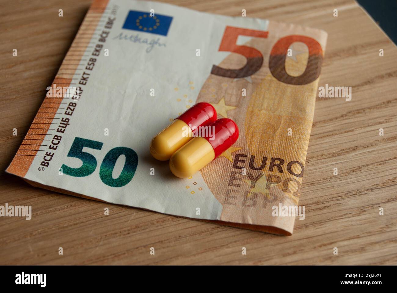 Conceptual image of antibiotic pills on currency, highlighting the ...