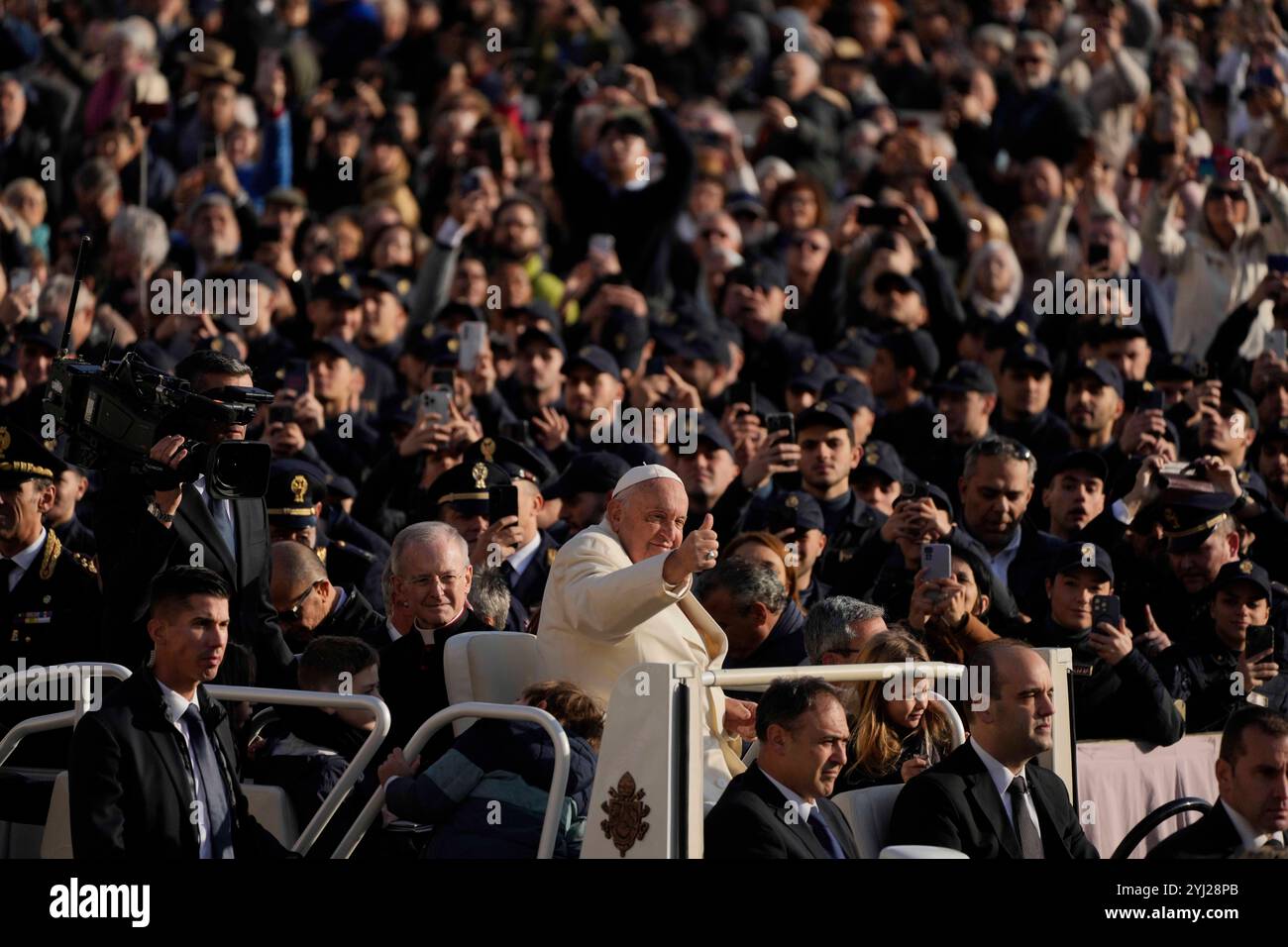 Pope Francis thumbs up as he arrives for his weekly general audience in ...
