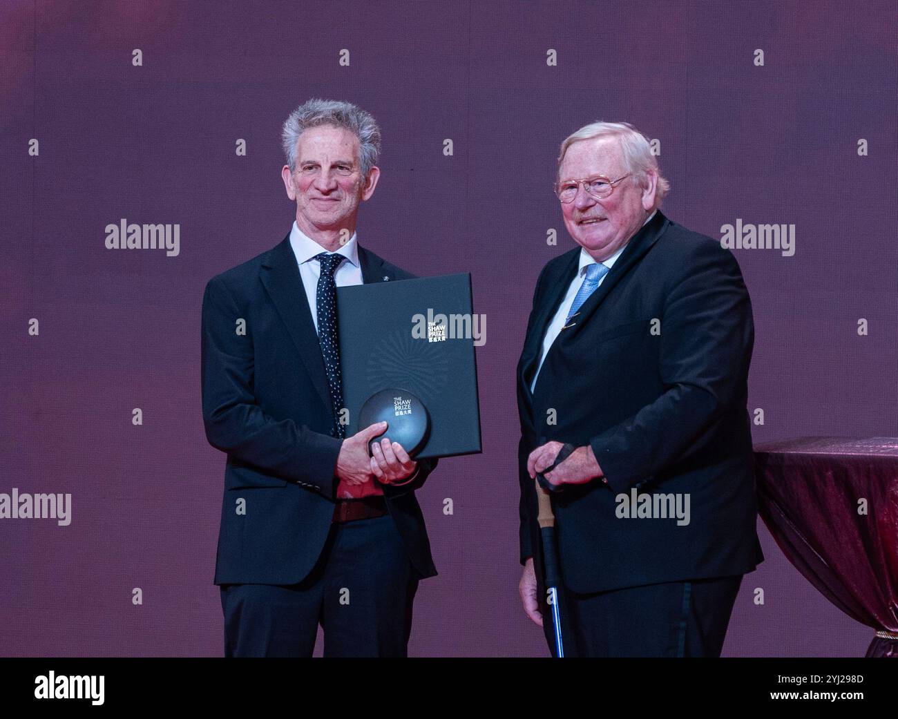 Professor Peter Sarnak (left) receives the certificate and medal. Hong ...