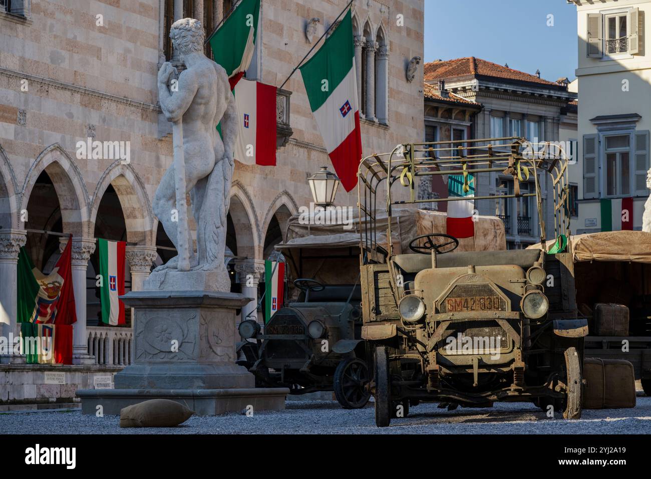World war 1 military vehicles on a beautiful Italian square. Historical ...