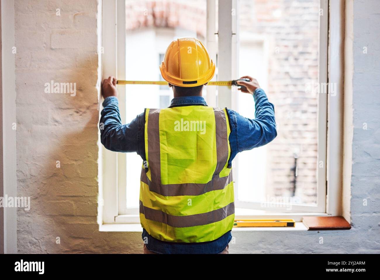 Engineer, man and measuring tape on window for construction, renovation ...