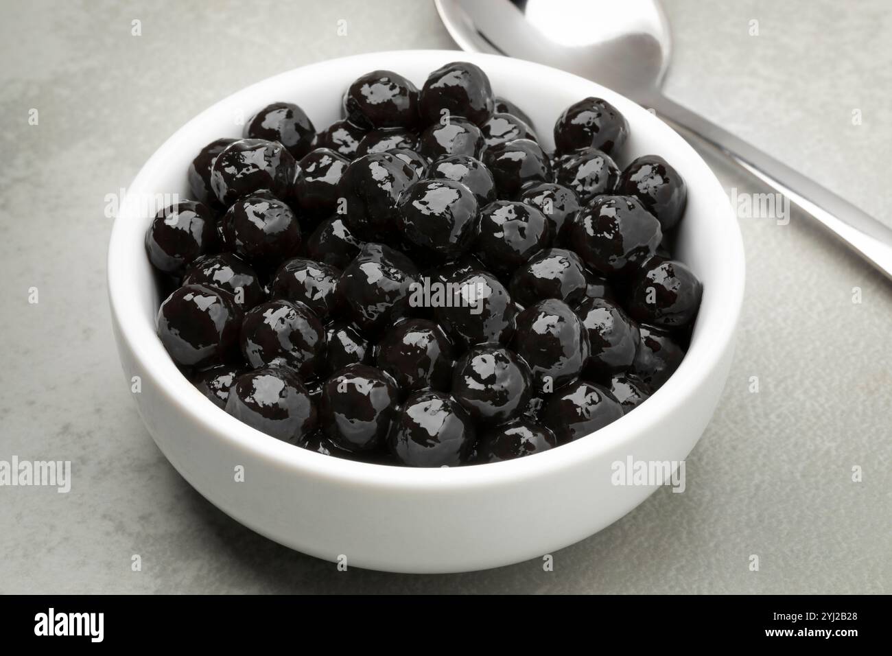 Ceramic bowl with cooked black tapioca pearls close up Stock Photo - Alamy