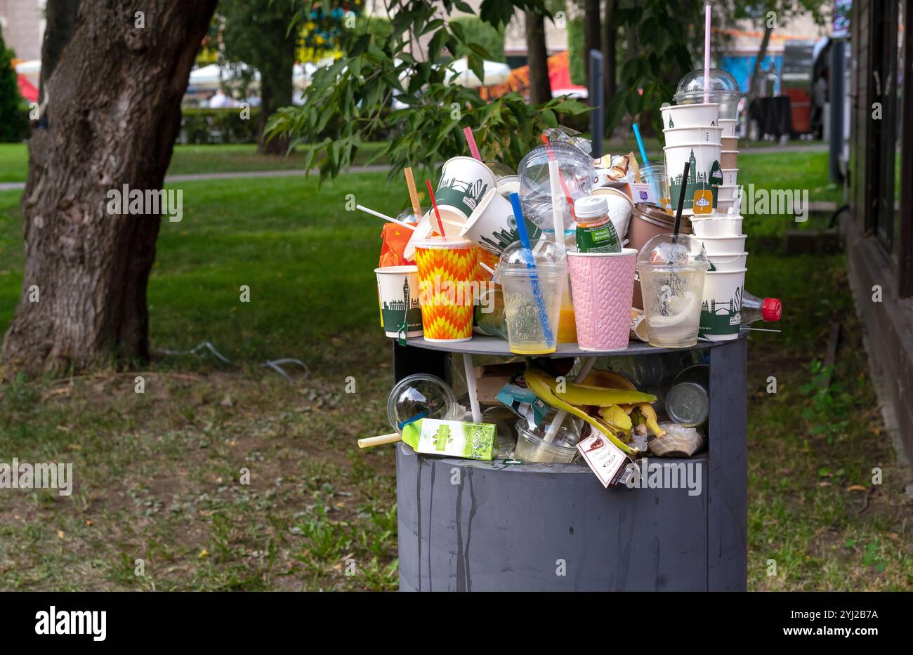 Full garbage bin on a street in the city. Concept of garbage pollution ...