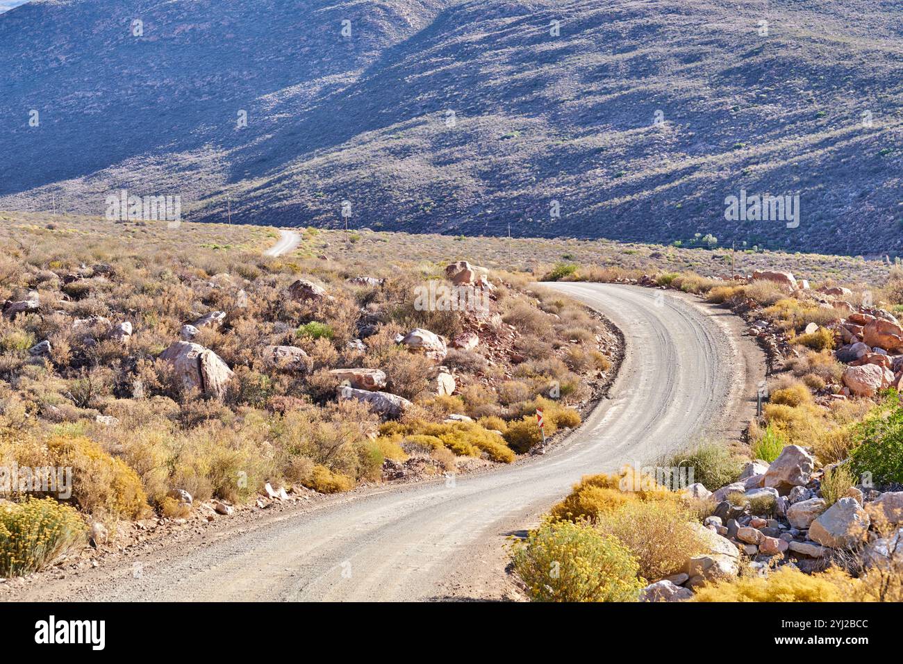 Landscape, mountains and rocks with road in nature for environment ...