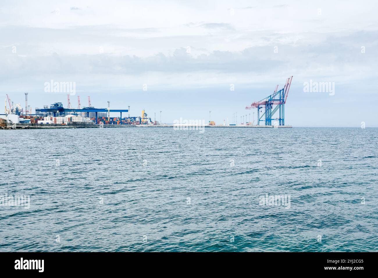 A cargo seaport full of containers. Loading and unloading of cargo ...