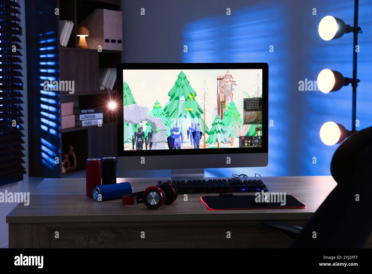 Computer keyboard, monitor, cans, headphones and mouse on table indoors Stock Photo - Alamy