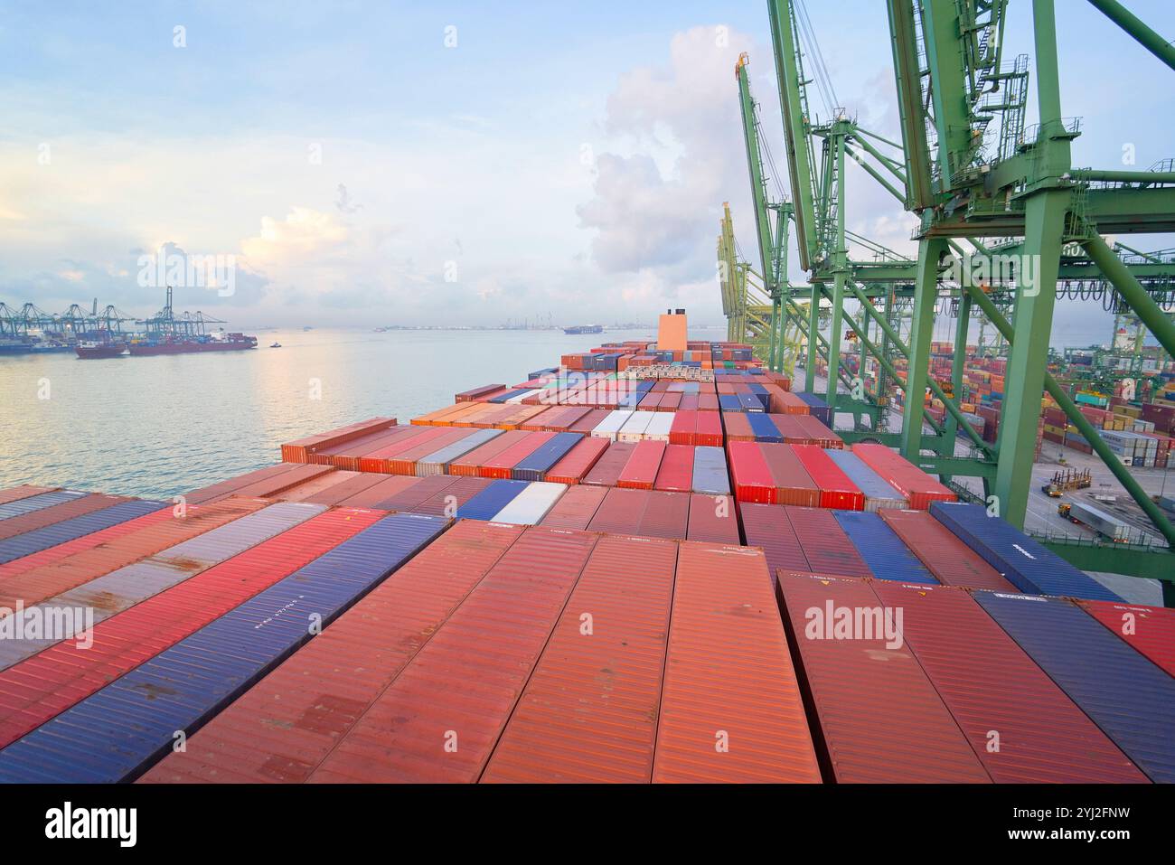 Cargo containers stacked on a ship at a commercial dock during early ...